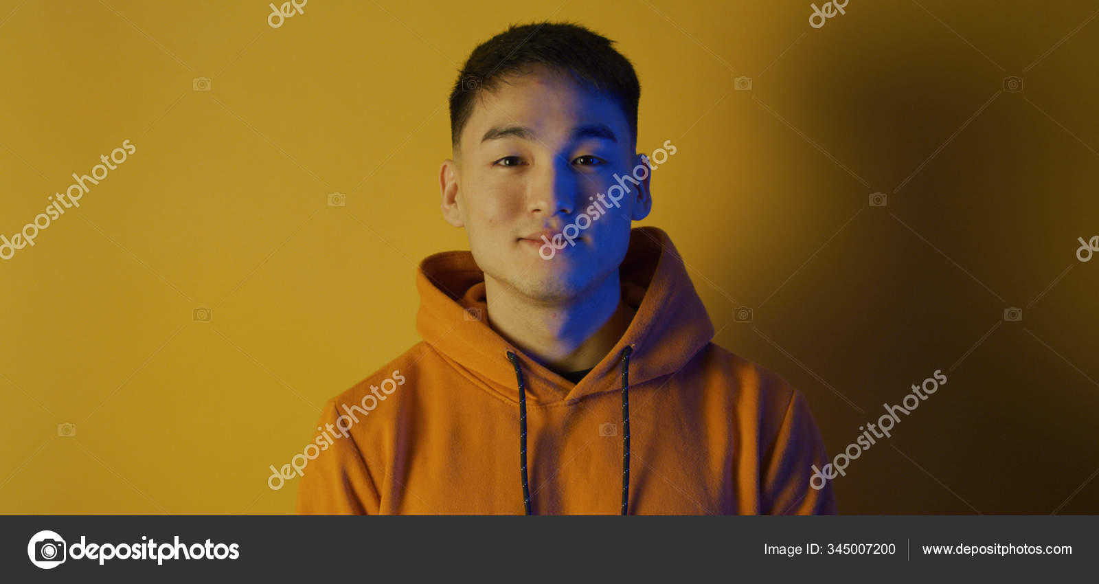 Young man smiling against yellow background — Stock Photo ...