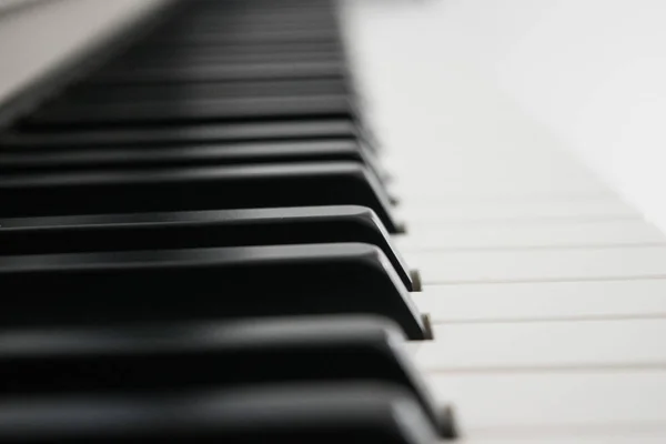 Piano keys side view — Stock Photo © OllyPlu #144481931