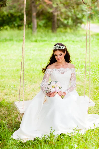 Portrait of very beautiful bride rope swing - Stock Image - Everypixel