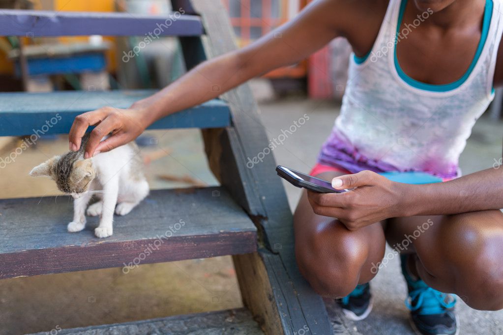 Afro woman with cat — Stock Photo © Myvisuals #127426128