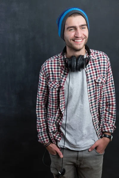 Handsome DJ posing in studio — Stock Photo © Myvisuals #130015804
