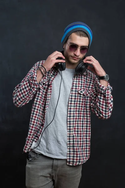 Handsome DJ posing in studio Stock Photo by ©Myvisuals 130009894