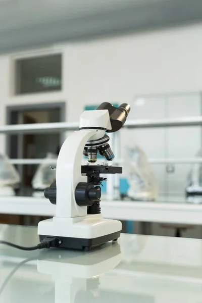 Microscope and test tubes in laboratory — Stock Photo © AndreyBezuglov ...