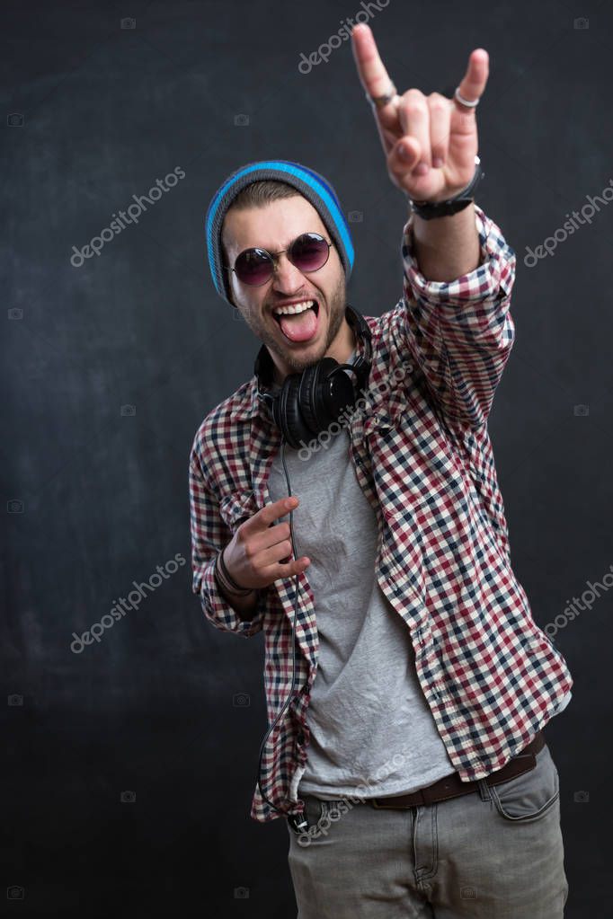 Handsome DJ posing in studio — Stock Photo © Myvisuals #130015804