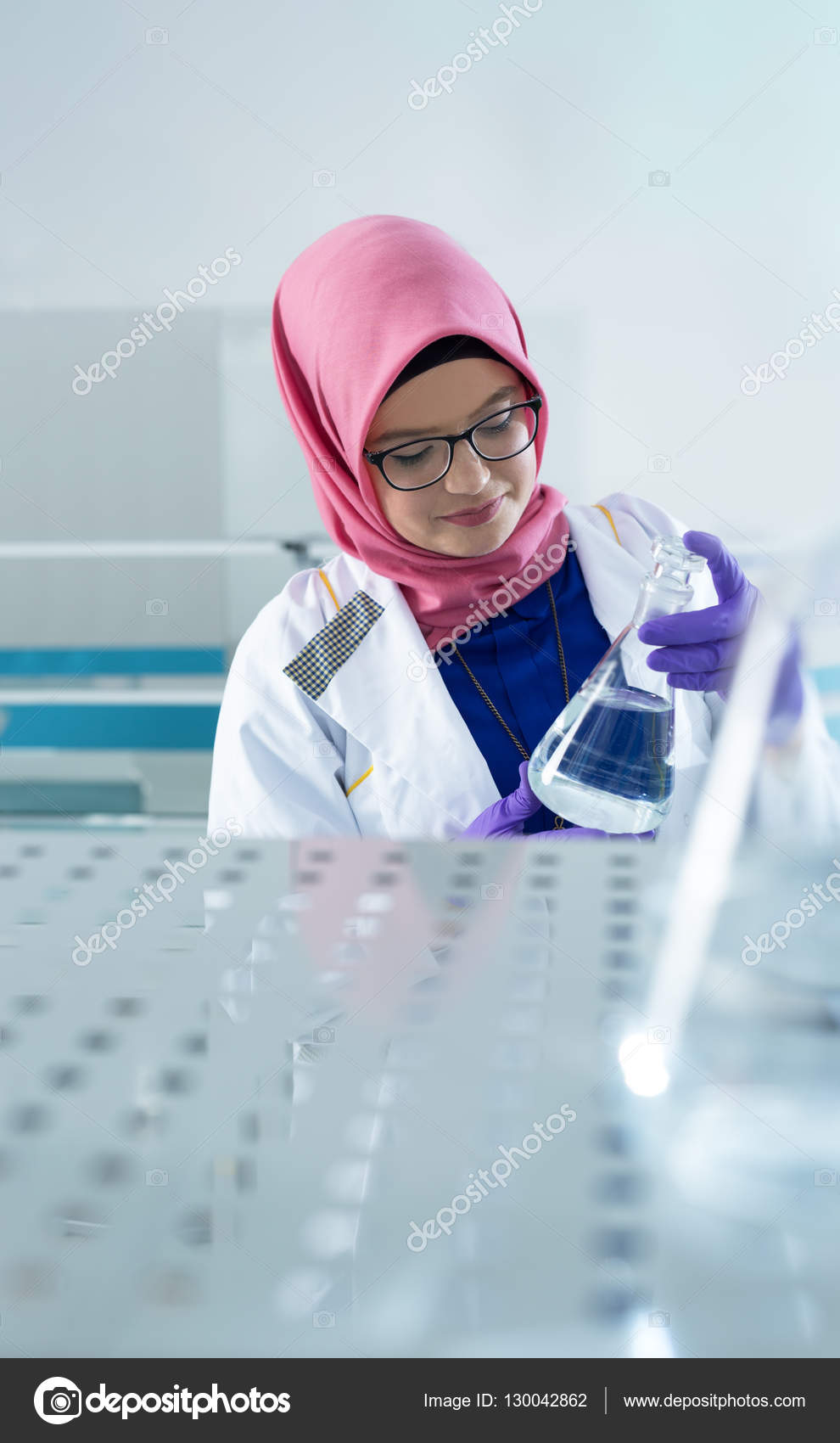 Muslim lab worker with hijab Stock Photo by ©Myvisuals 130042862