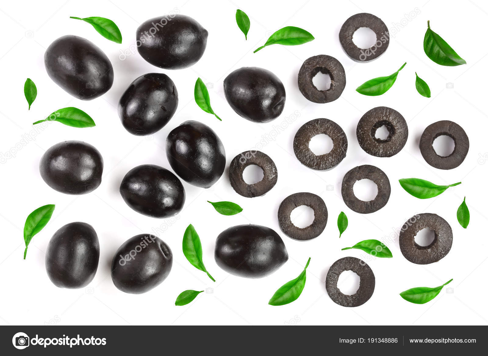 Whole and sliced black olives isolated on white background. Top view ...