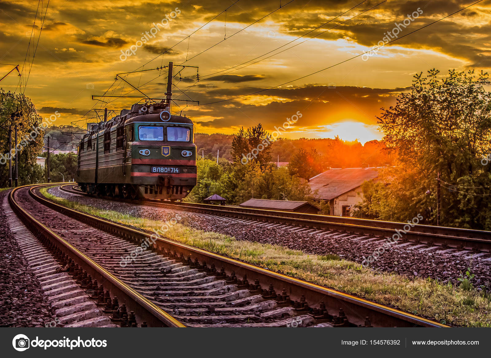 Moving train on sunset background Stock Photo by ©ArtemKnyaz 154576392