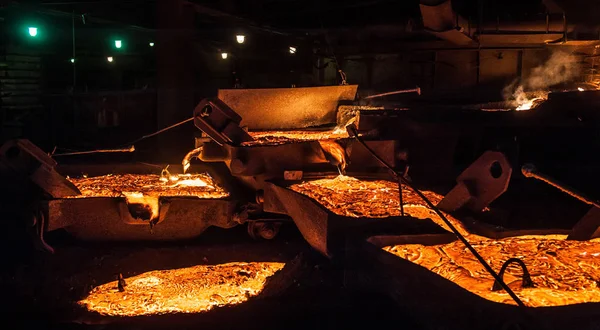 Pouring liquid titanium slag from arc furnace - Stock Image - Everypixel