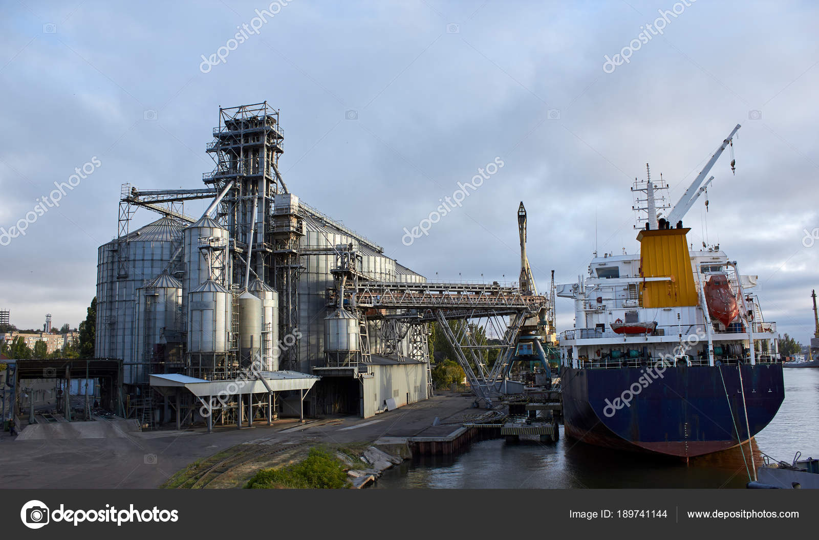 Big grain terminal at seaport. Cereals bulk transshipment from road ...
