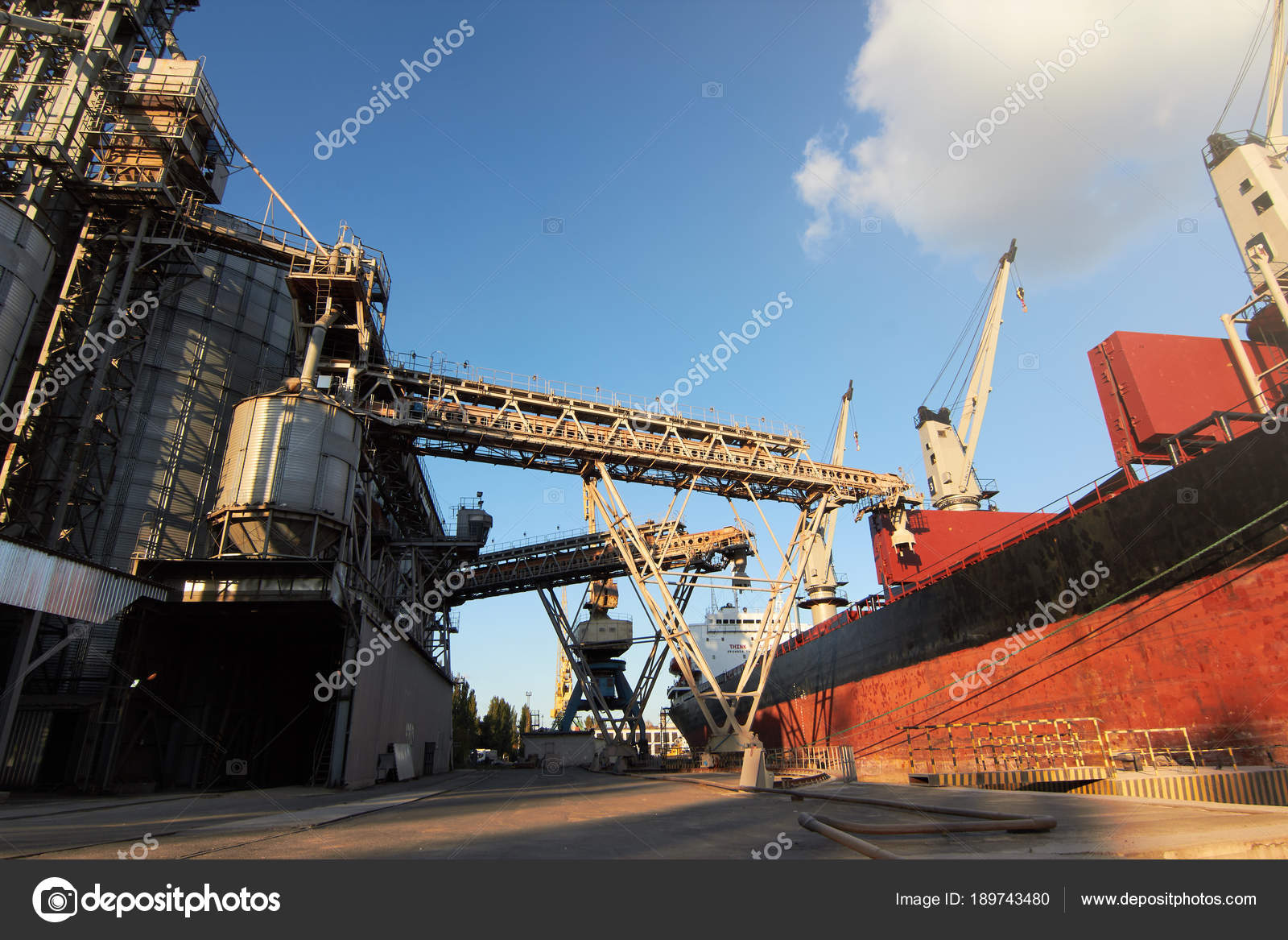 Big grain terminal at seaport. Cereals bulk transshipment from road ...