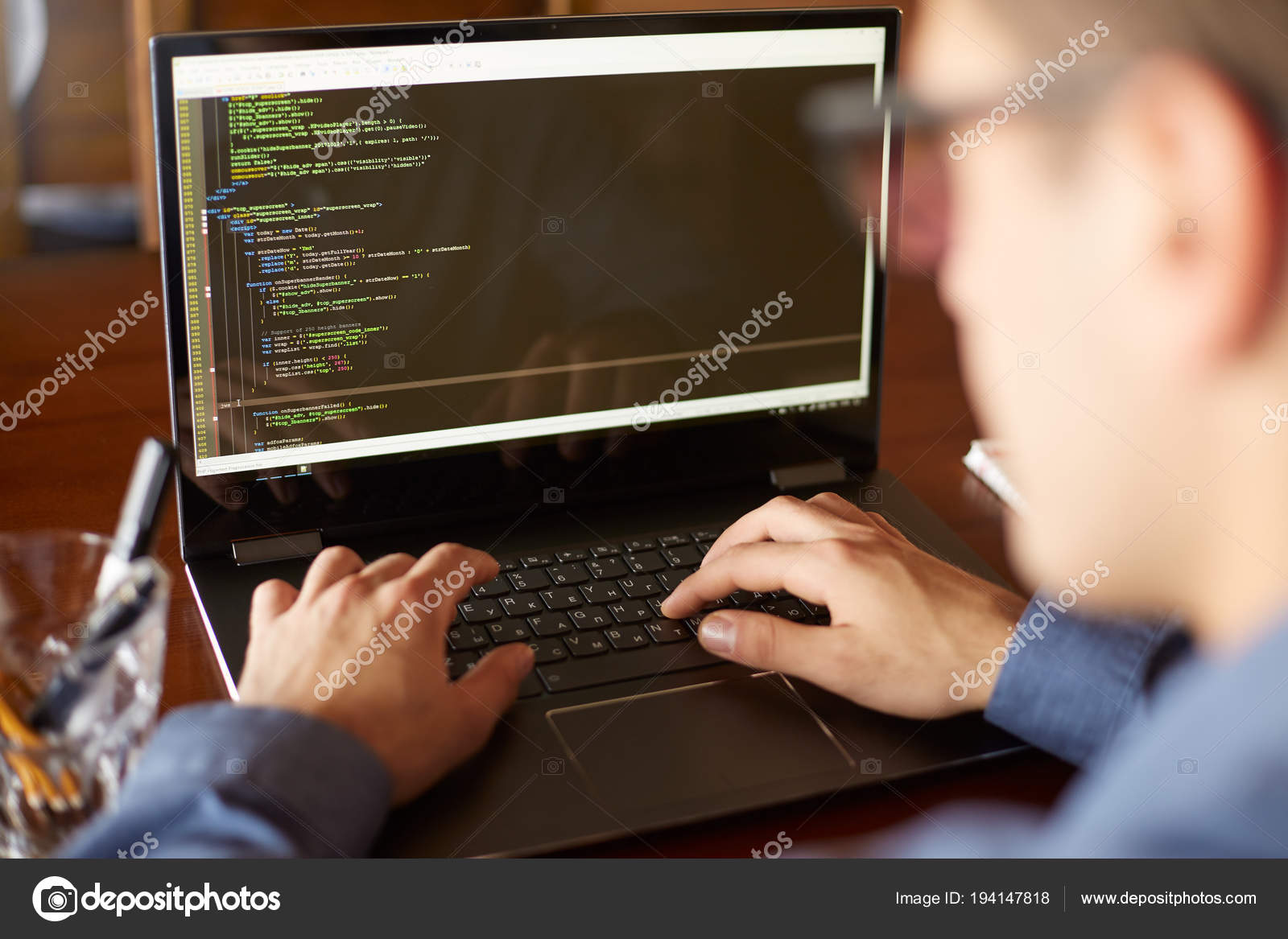 Back view over the shoulder shot of developer programmer with laptop ... Back view over the shoulder shot of developer programmer with laptop ...