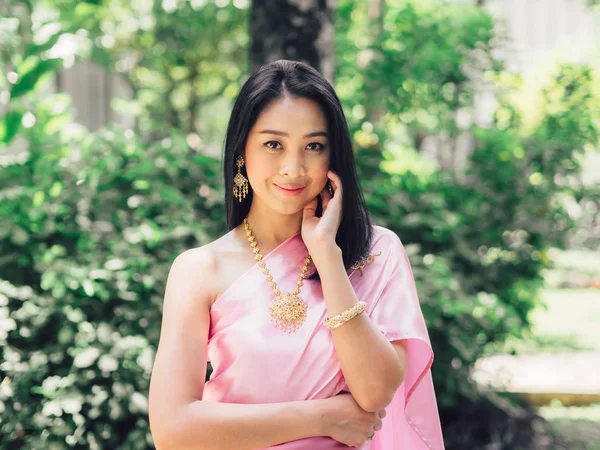 Half body portrait of Thai woman in Thai traditional custome stand in ...
