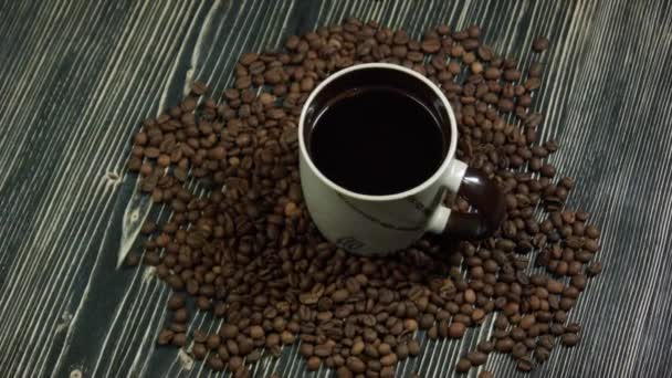 Drop falling into a cup of coffee. On a wooden background — Stock Video ...