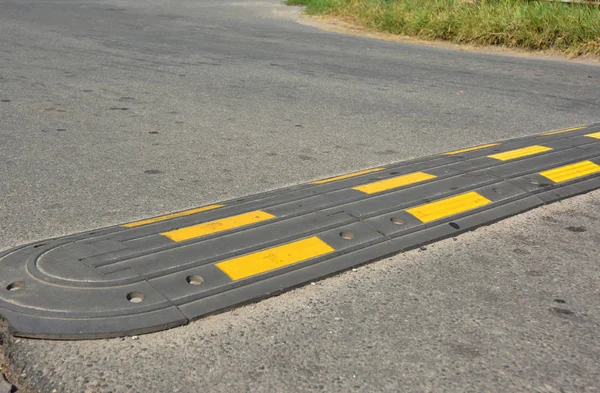Traffic safety speed bump on an asphalt road. Speed bumps (or speed ...
