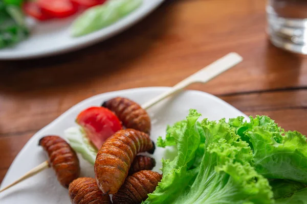 Fried Worm, Insect food with vegetable salad in the white bowl. - Stock ...