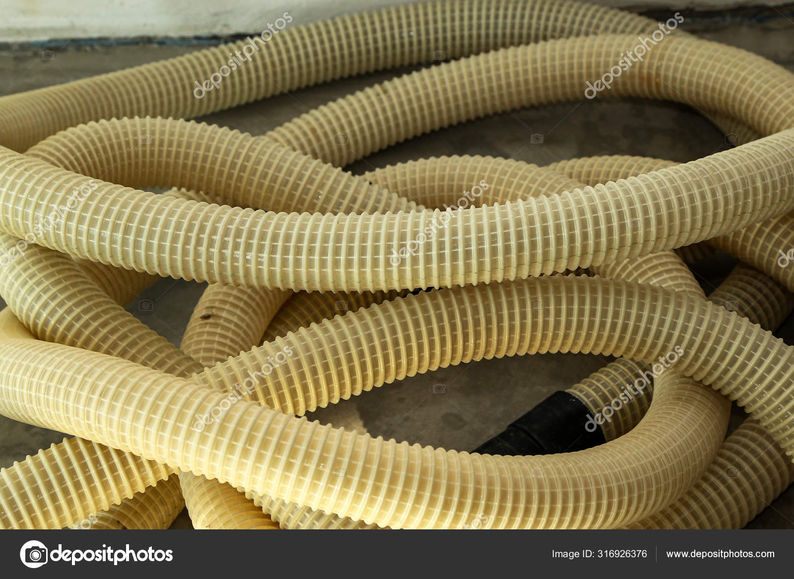 Yellow plastic corrugated tubes for water supply, rolled up — Stock ...