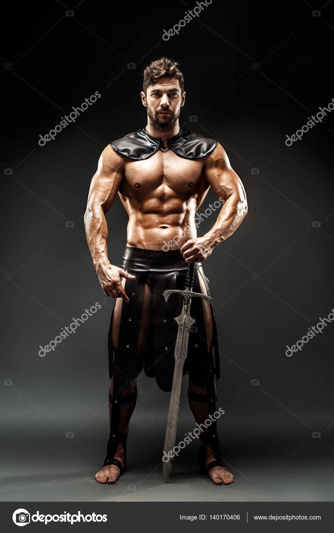 Severe barbarian in leather costume with sword Stock Photo by ©zamuruev ...