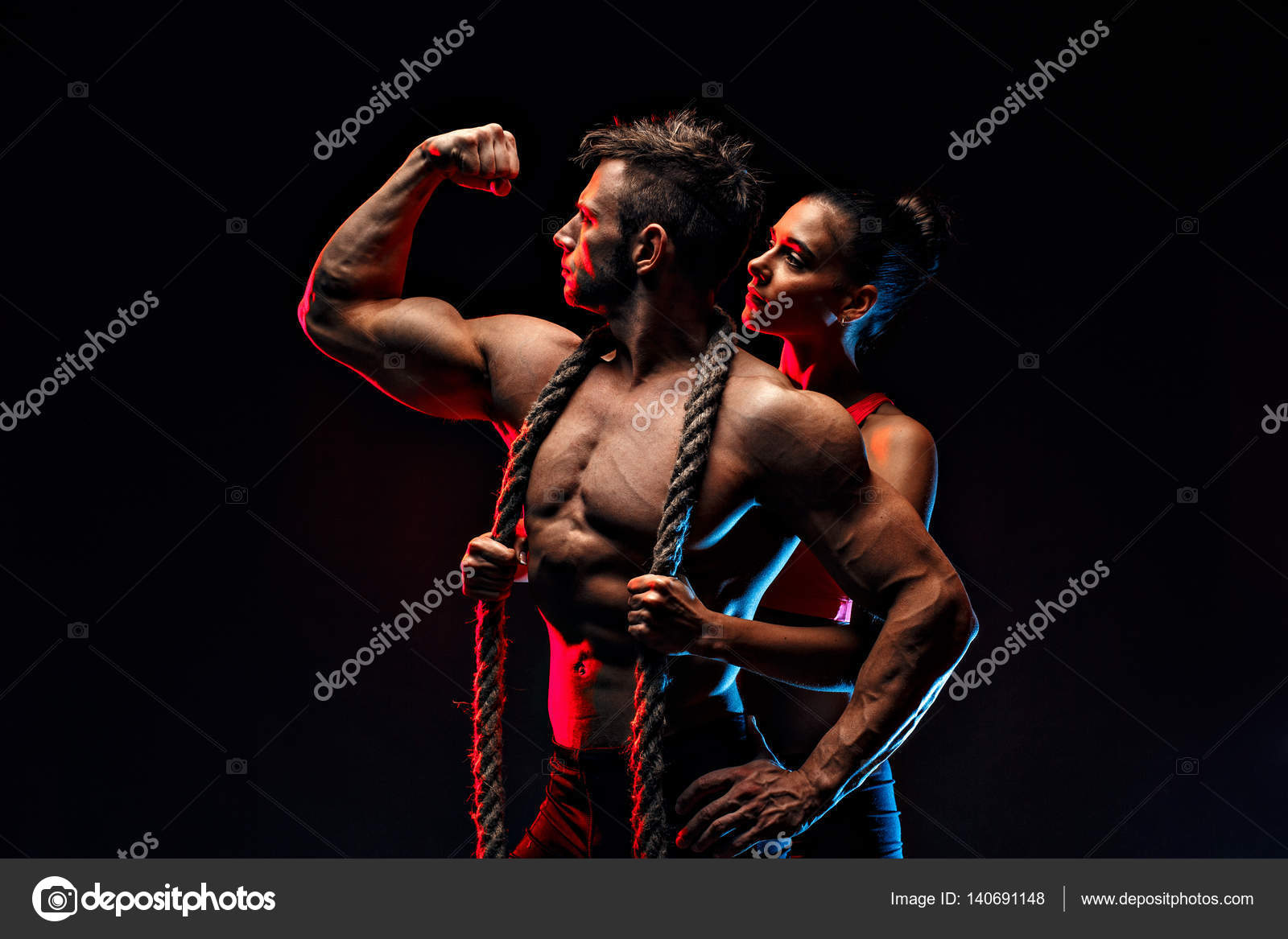 Bodybuilders posing with rope and smoke around. Stock Photo by ...