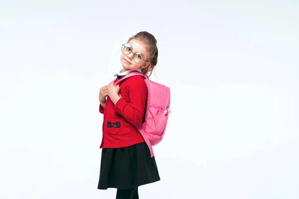 Adorable little girl in red school jacket, black dress, backpack Stock ...