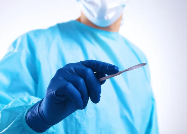 Surgeon hand hold scalpel and tweezers while cut cure wound closeup ...