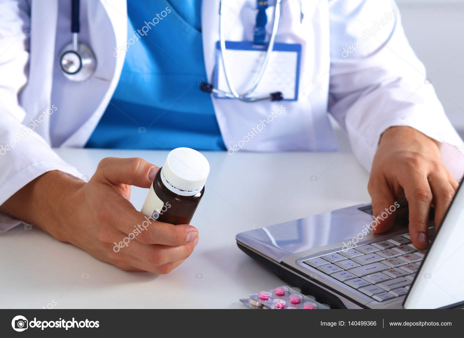 The doctor writes a prescription pill on the computer Stock Photo by ...