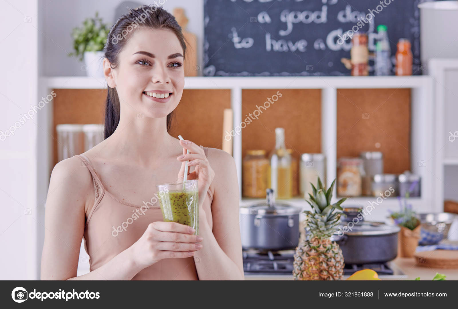 A young girl drinks a cocktail on a kitchen Stock Photo by ...