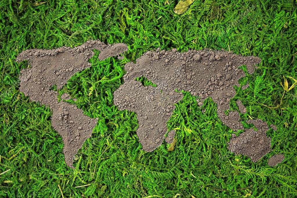 Concept ecology. World map, globe from the soil on natural background ...