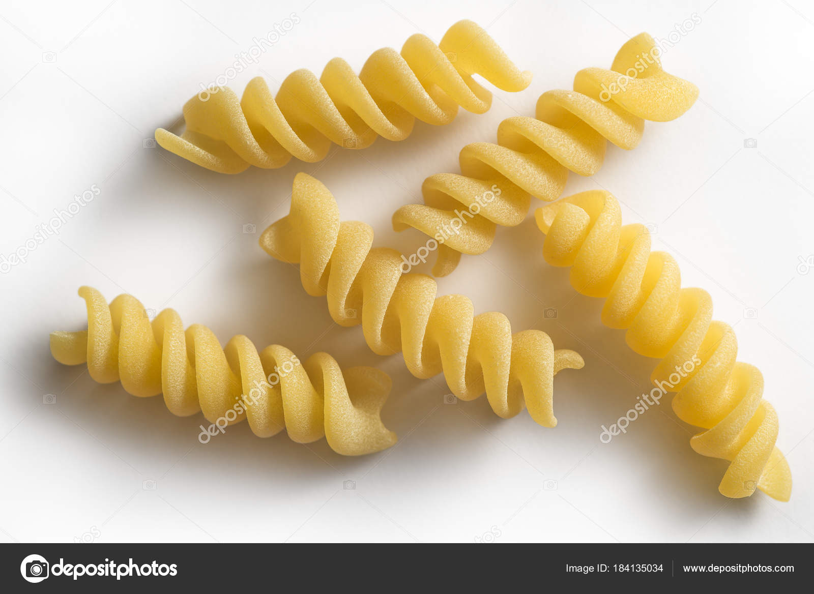 Five pieces of Fusilli pasta isolated on white background — Stock Photo ...