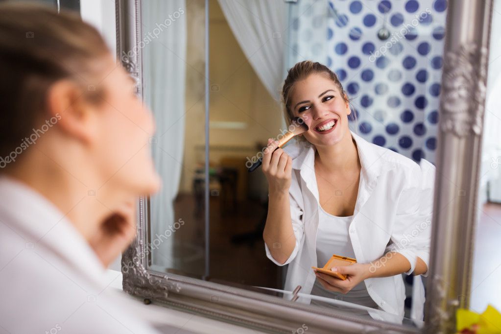 Beautiful woman applying makeup — Stock Photo © nd3000 #127063140