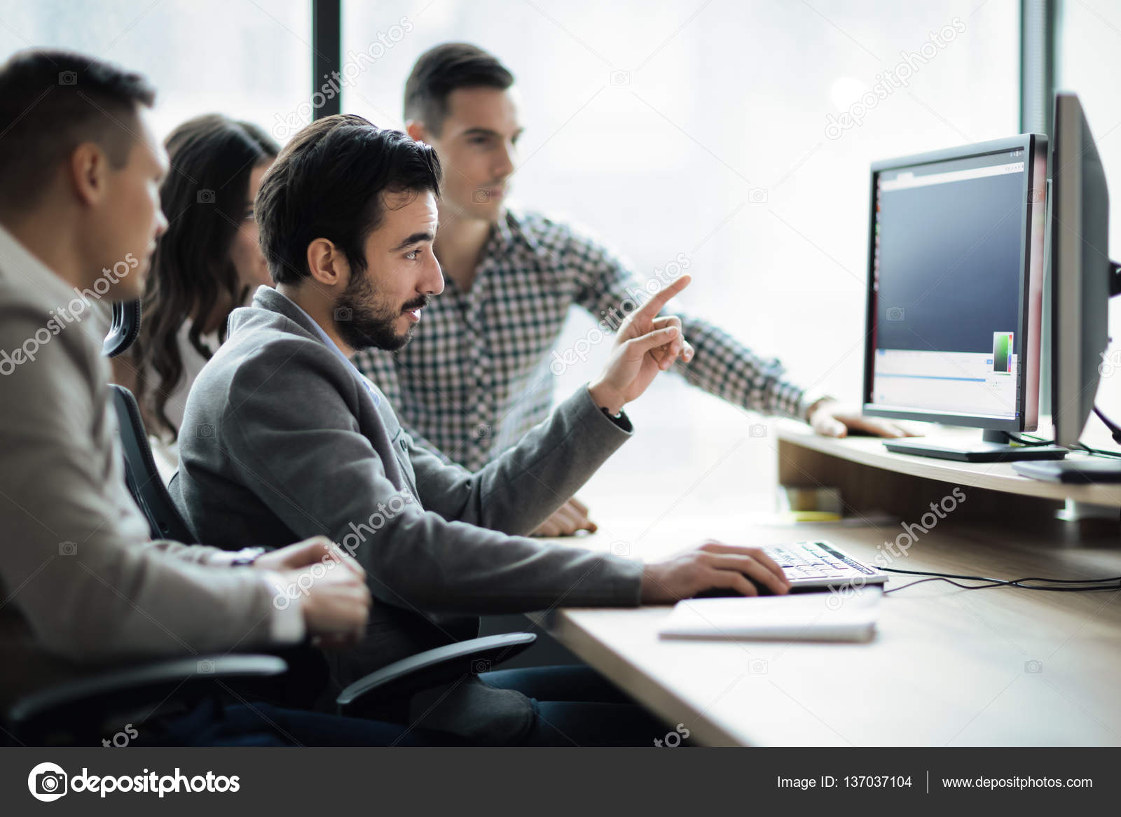 Software engineers working in office on project together — Stock Photo ...