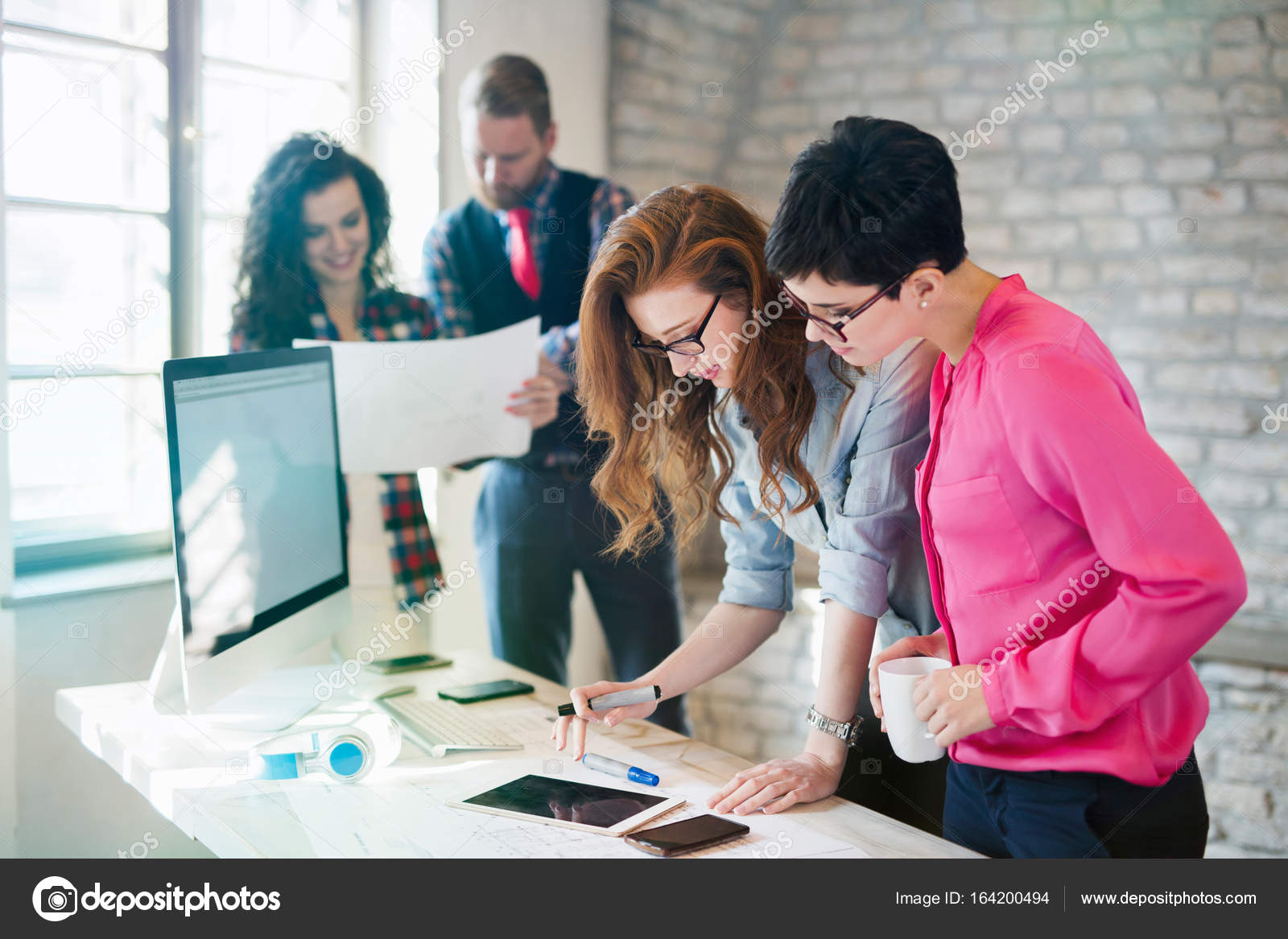 Group of young architects using digital tablet Stock Photo by ©nd3000 ...