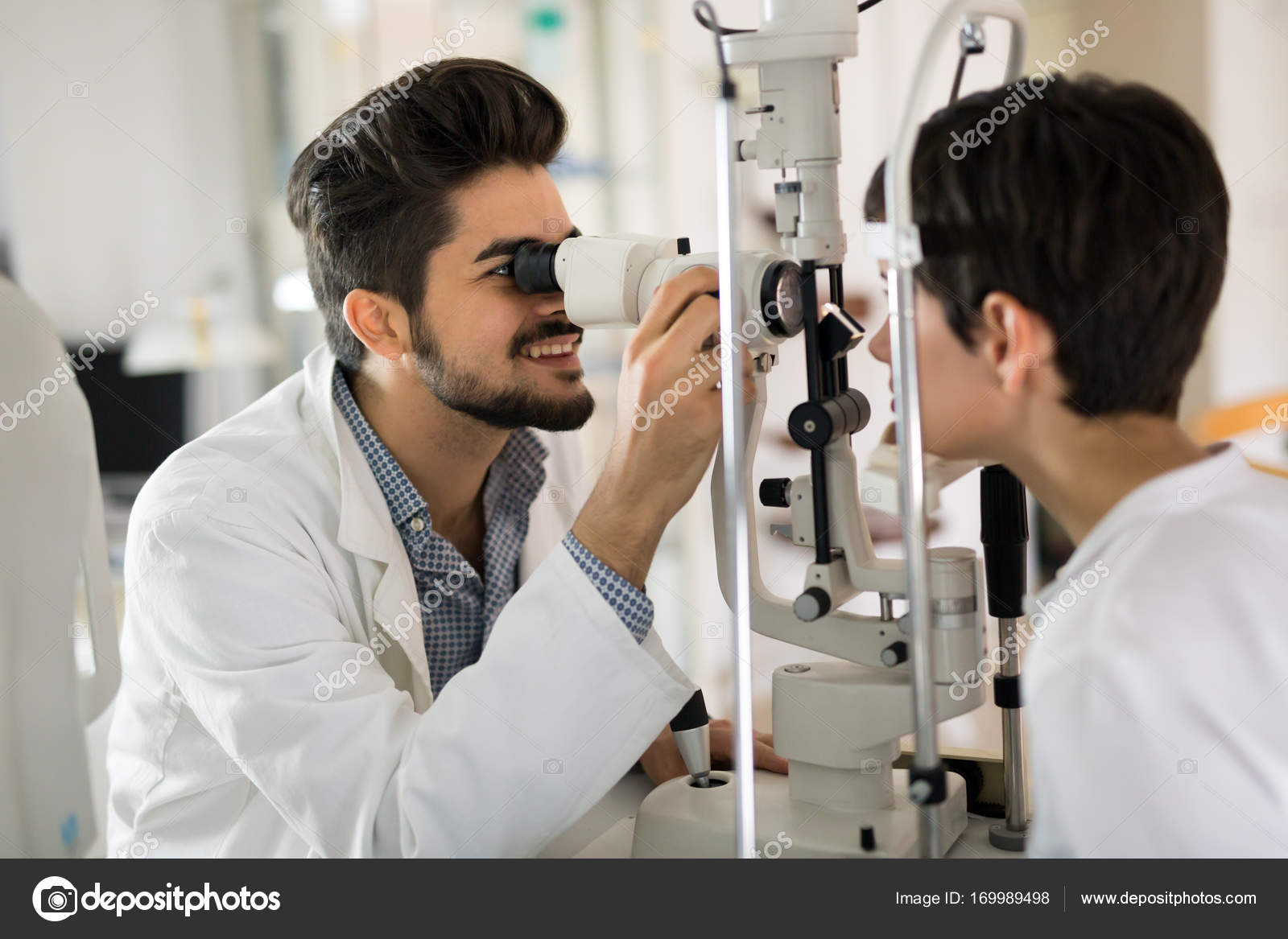 Optometrist checking patient eyesight — Stock Photo © nd3000 #169989498