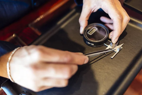 Jeweler checking size of diamond — Stock Photo © nd3000 #138029314