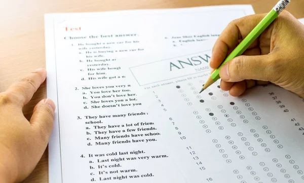 Moving Blur Hand Marking Answer Sheet Stock Photo by ©lamaip 207600634