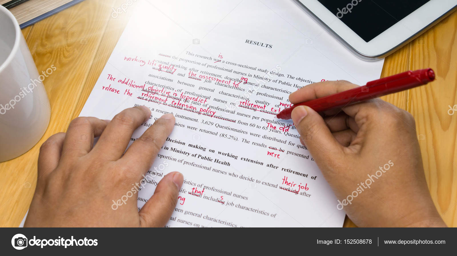 Hand holding red pen over proofreading text — Stock Photo © lamaip ...