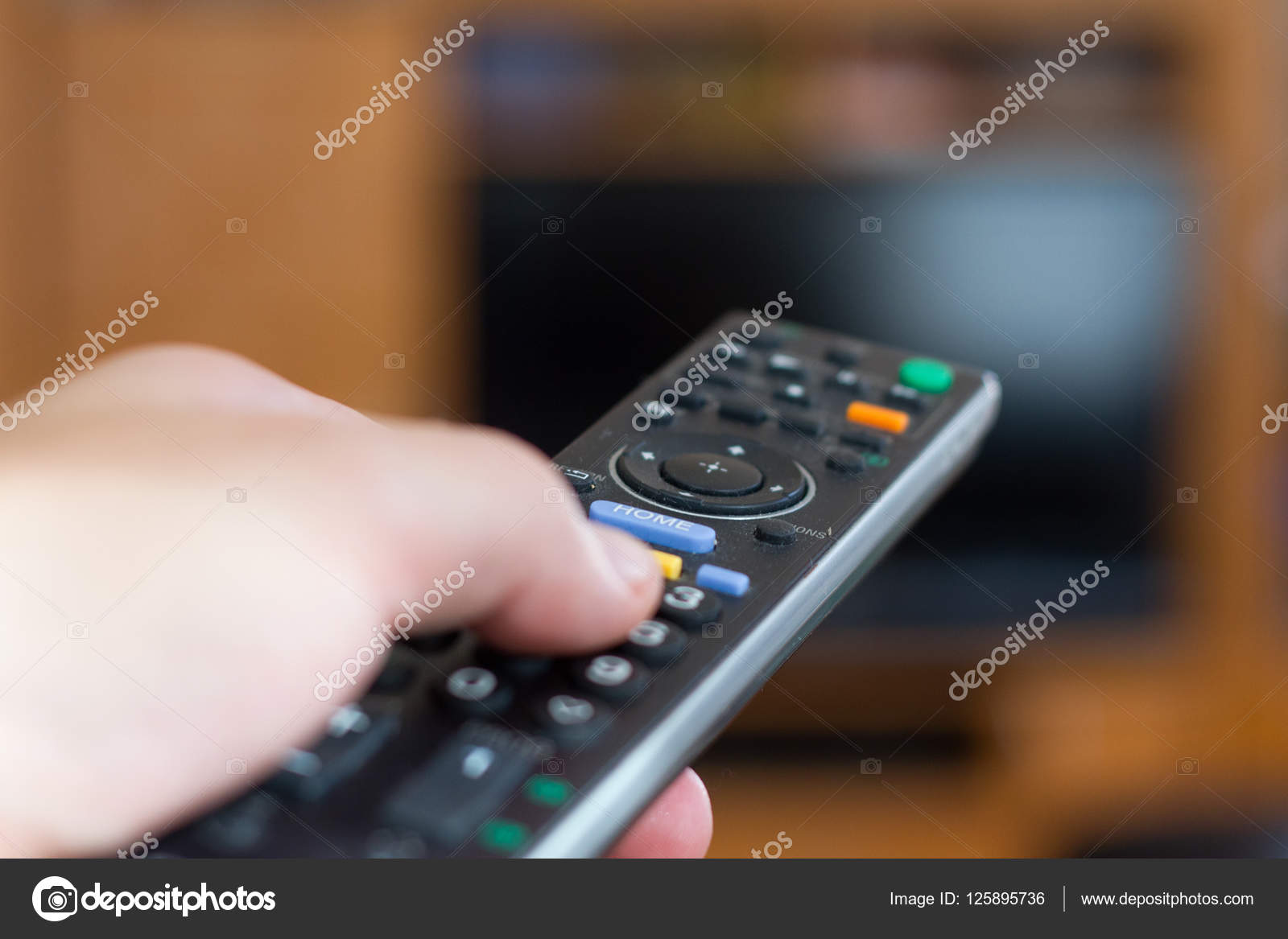 Watching tv, television remote control, controller in hand Stock Photo ...