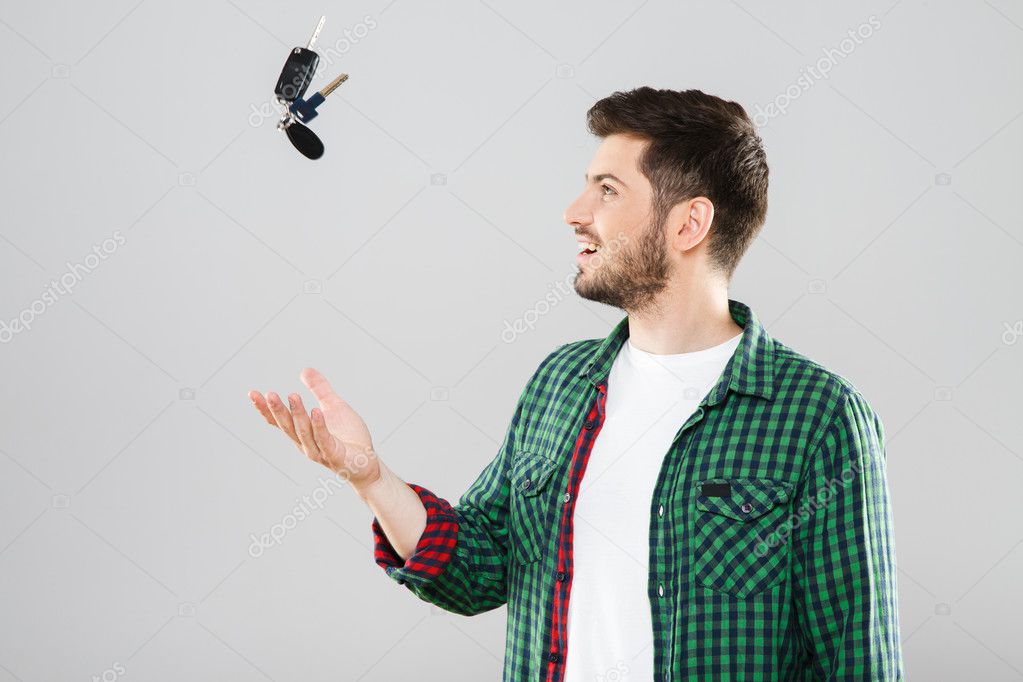 Man throwing up car keys Stock Photo by ©VelesStudio 125925624