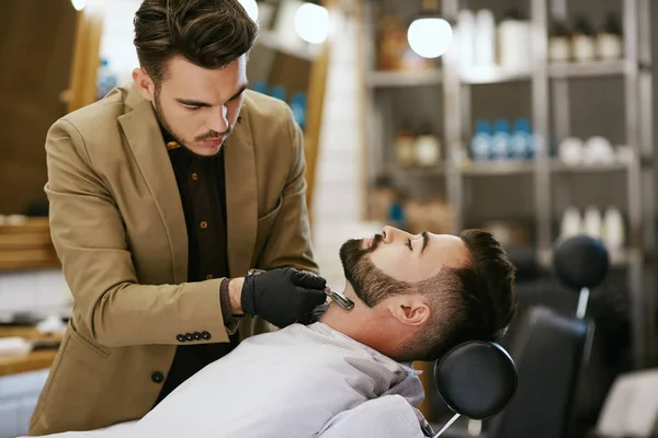 Barber doing haircuts for client Stock Photo by ©VelesStudio 115664746
