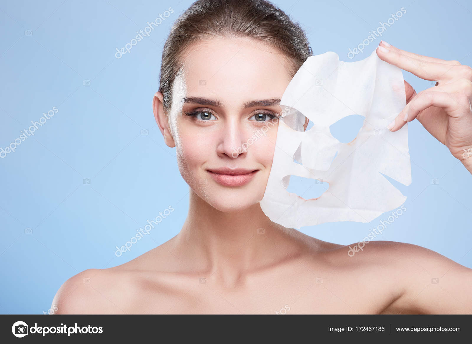 Woman removing mask from face — Stock Photo © VelesStudio #172467186