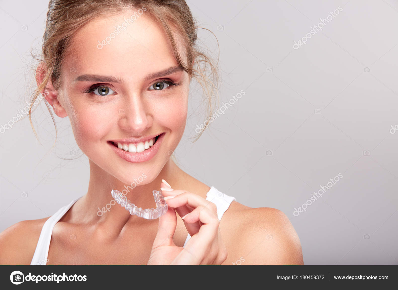 Woman with false tooth Stock Photo by ©VelesStudio 180459372