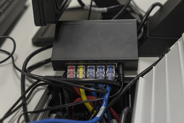 Hub and wire lan on white table and computer - Stock Image - Everypixel