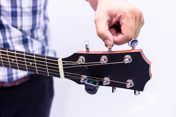 Person tuning a guitar Stock Photo by ©aona2303 125996946