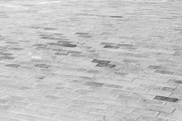 Top view on monochrome paving stone road. Old pavement of granite ...