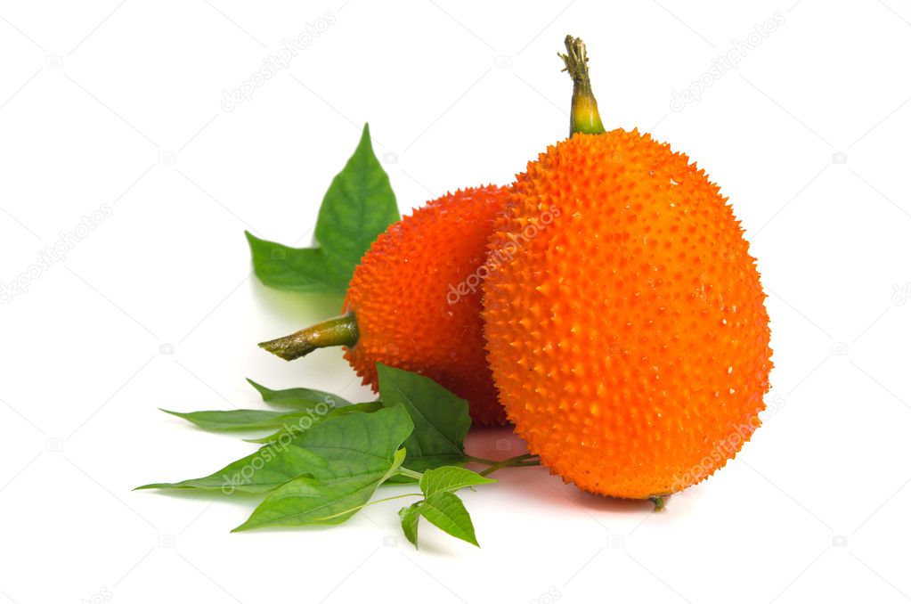 Gac fruit, typical of orange-colored plant foods in Asia isolate Stock ...