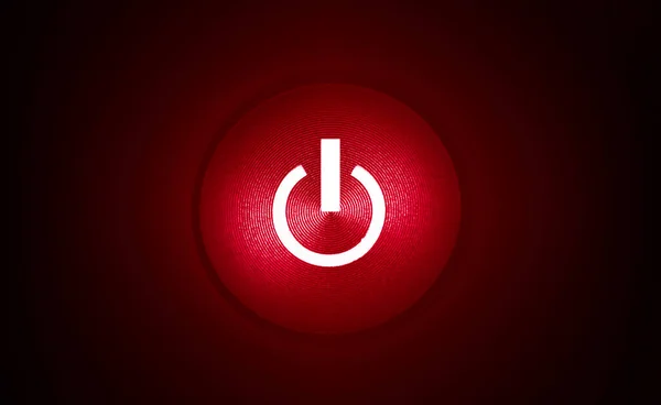 red power button with red light in the dark, black background - Stock ...