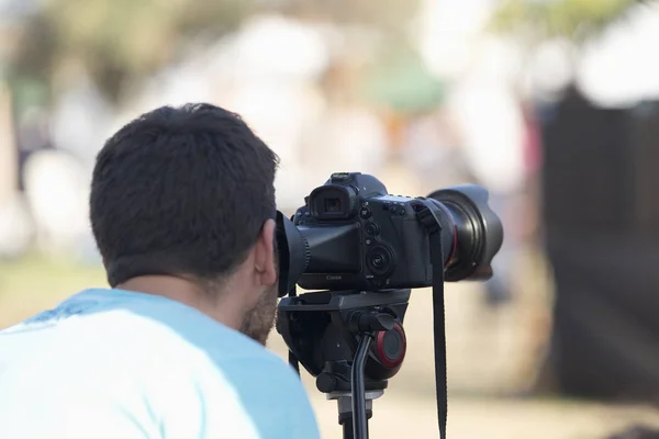Camera operator shooting on location event – Stock Editorial Photo ...