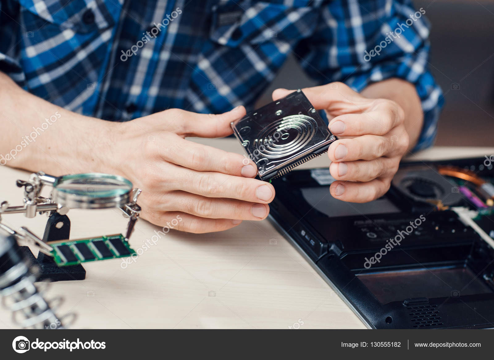 Engineer holding winchester disk in hands — Stock Photo © golubovy ...