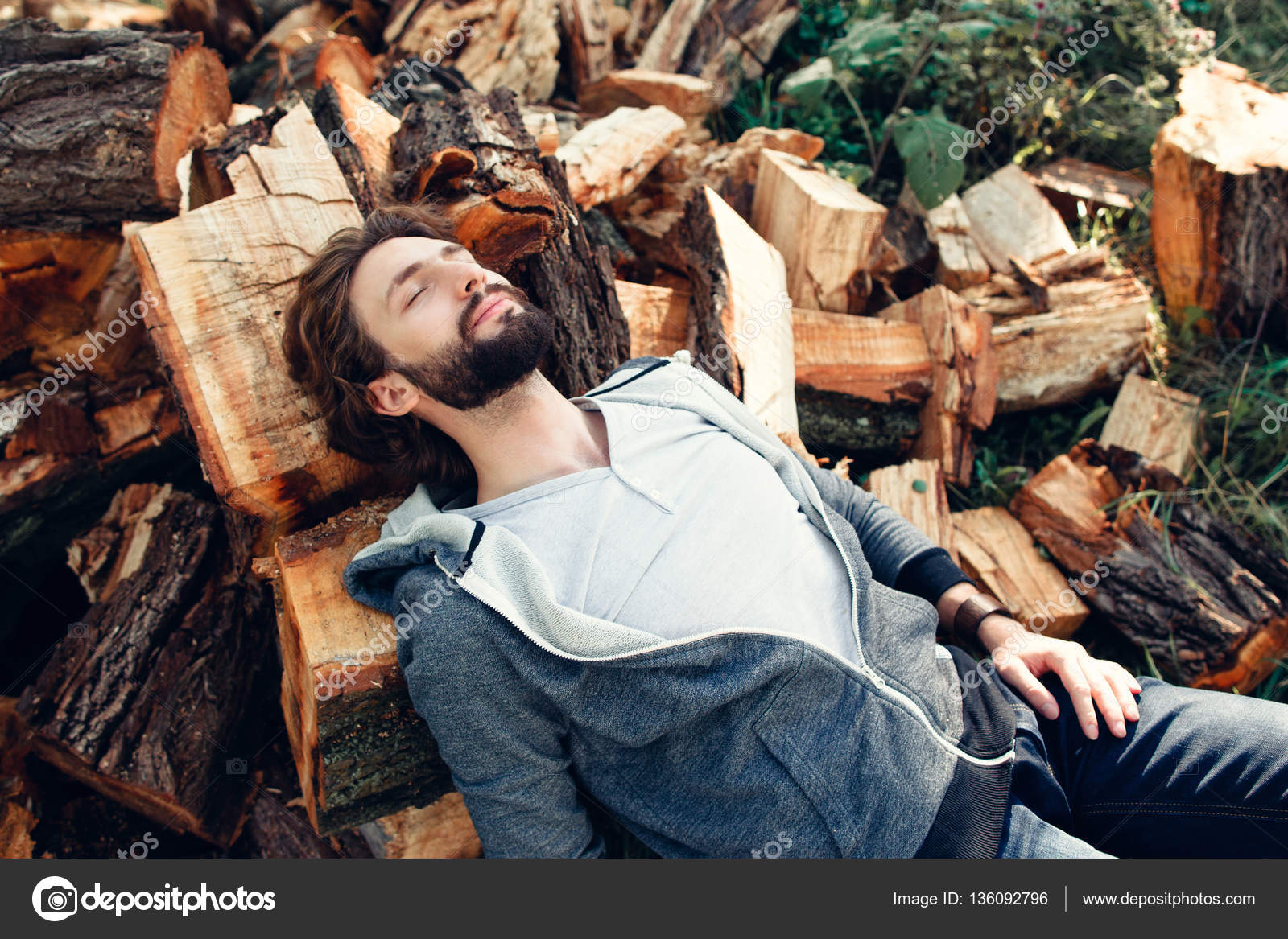 Tired lumberjack sleeping on pile of wood Stock Photo by ©golubovy ...