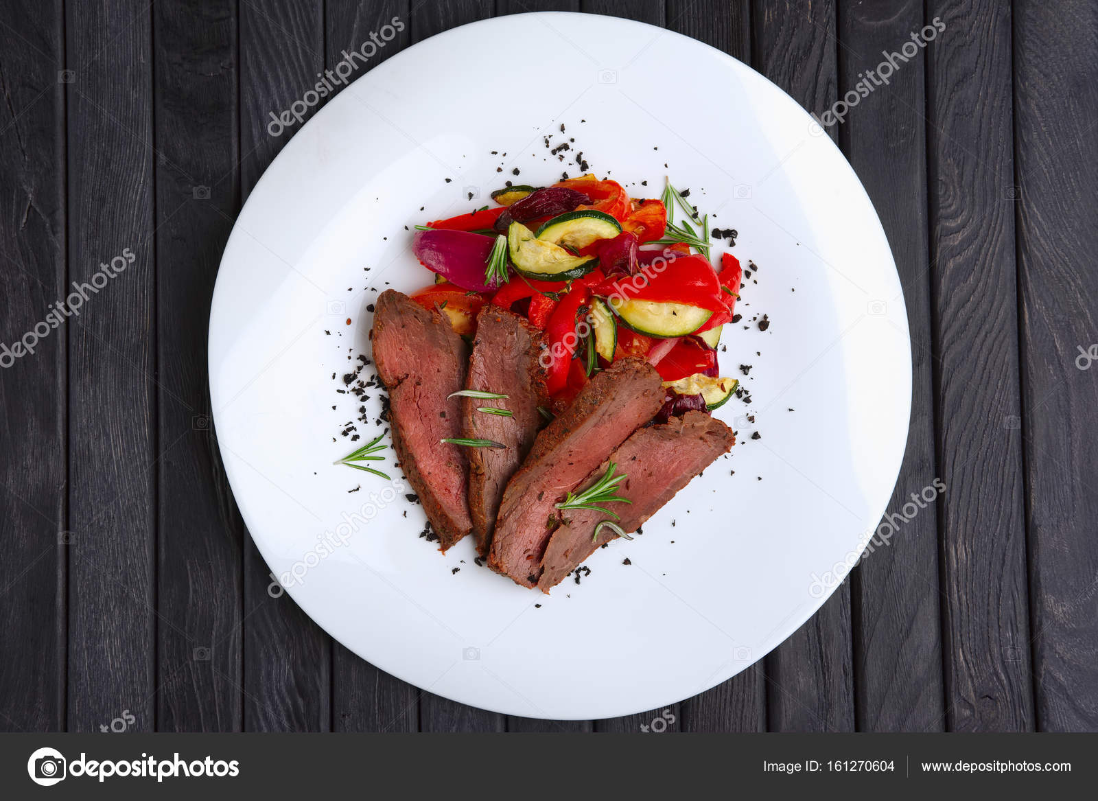 Top view of roasted beef cutted on slices with grilled bell pepp Stock ...