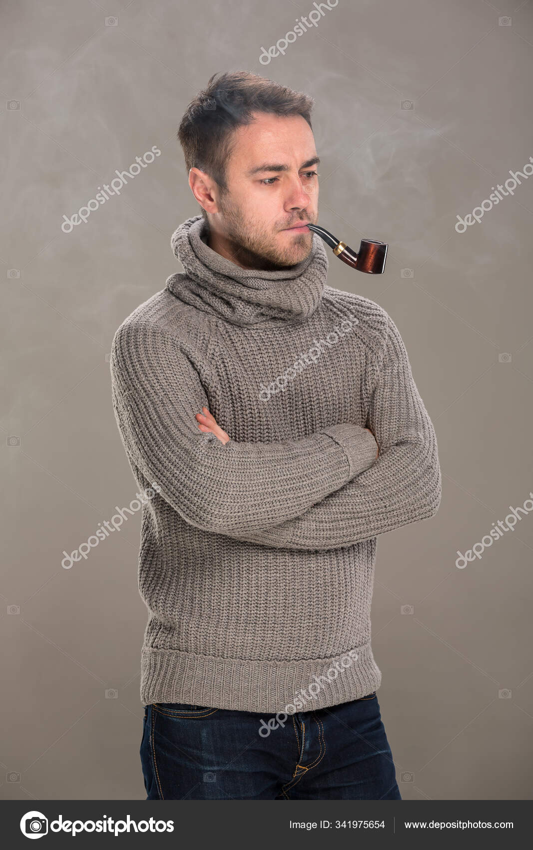 Man lights a pipe Stock Photo by ©vkaganovich 341975654